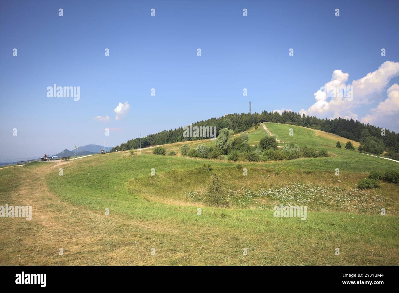 Small plateau on a mountain peak with groves and antennae on the peaks ...