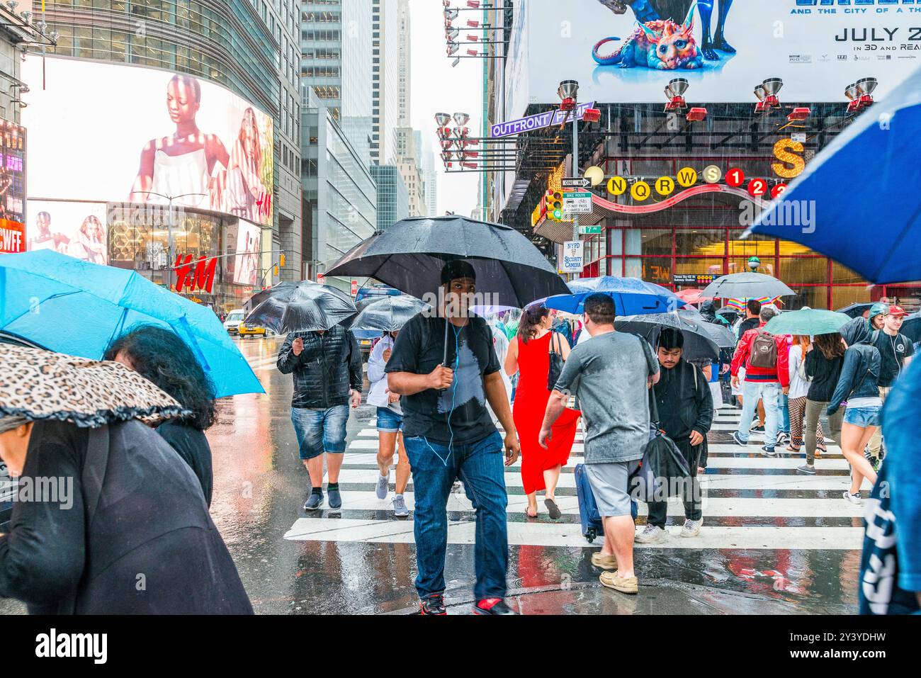 Busy Rainy Street Scene in Times Square, New York City Stock Photo - Alamy