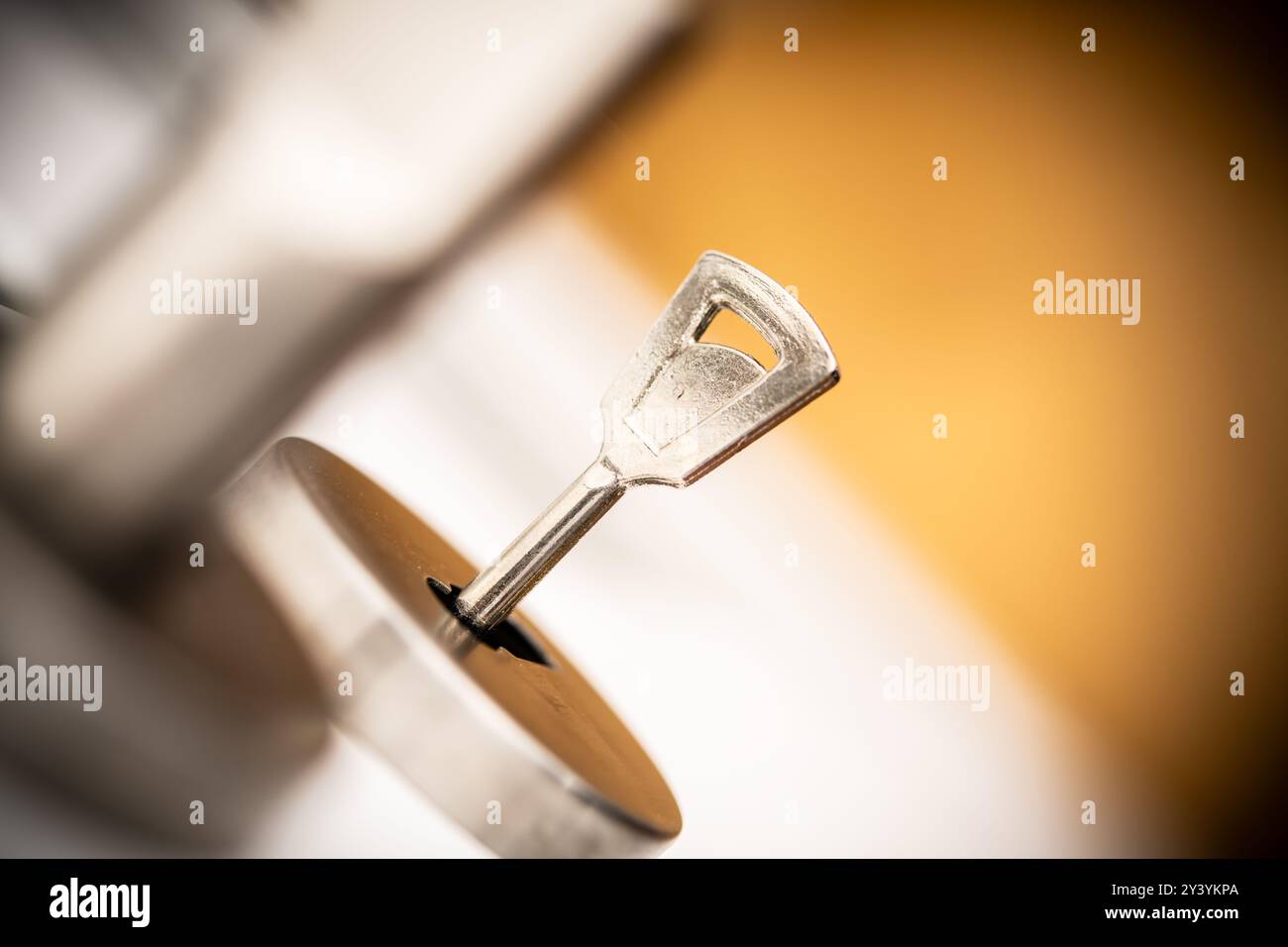 A detailed view of a silver key in a lock, exemplifying security ...