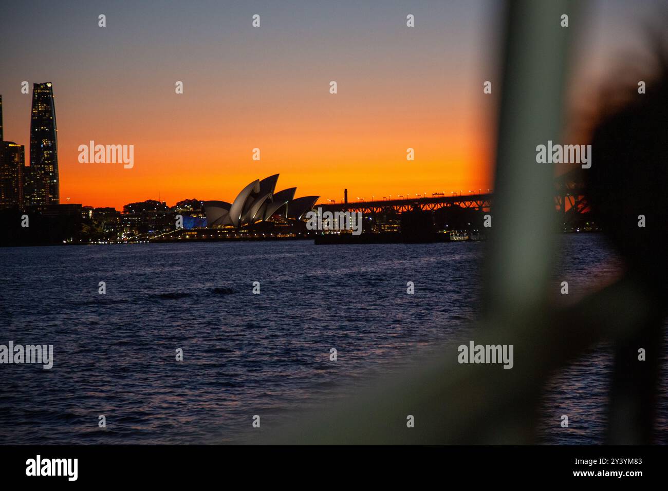 The Sydney Opera House and harbour at sunset viewed from the Manly Fast ...