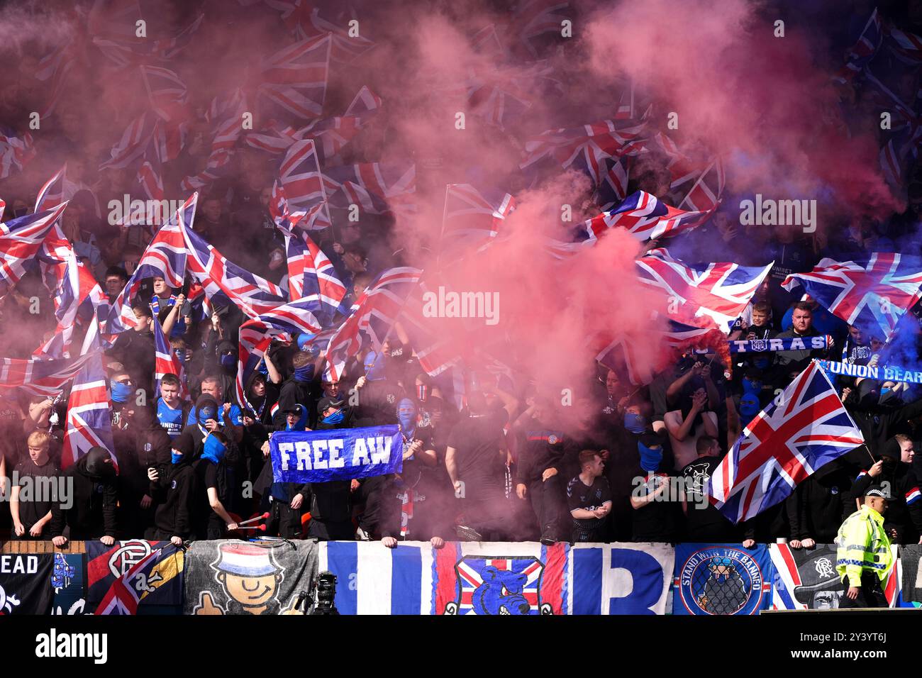 Rangers fans set off flares and wave flags of the United Kindom prior ...
