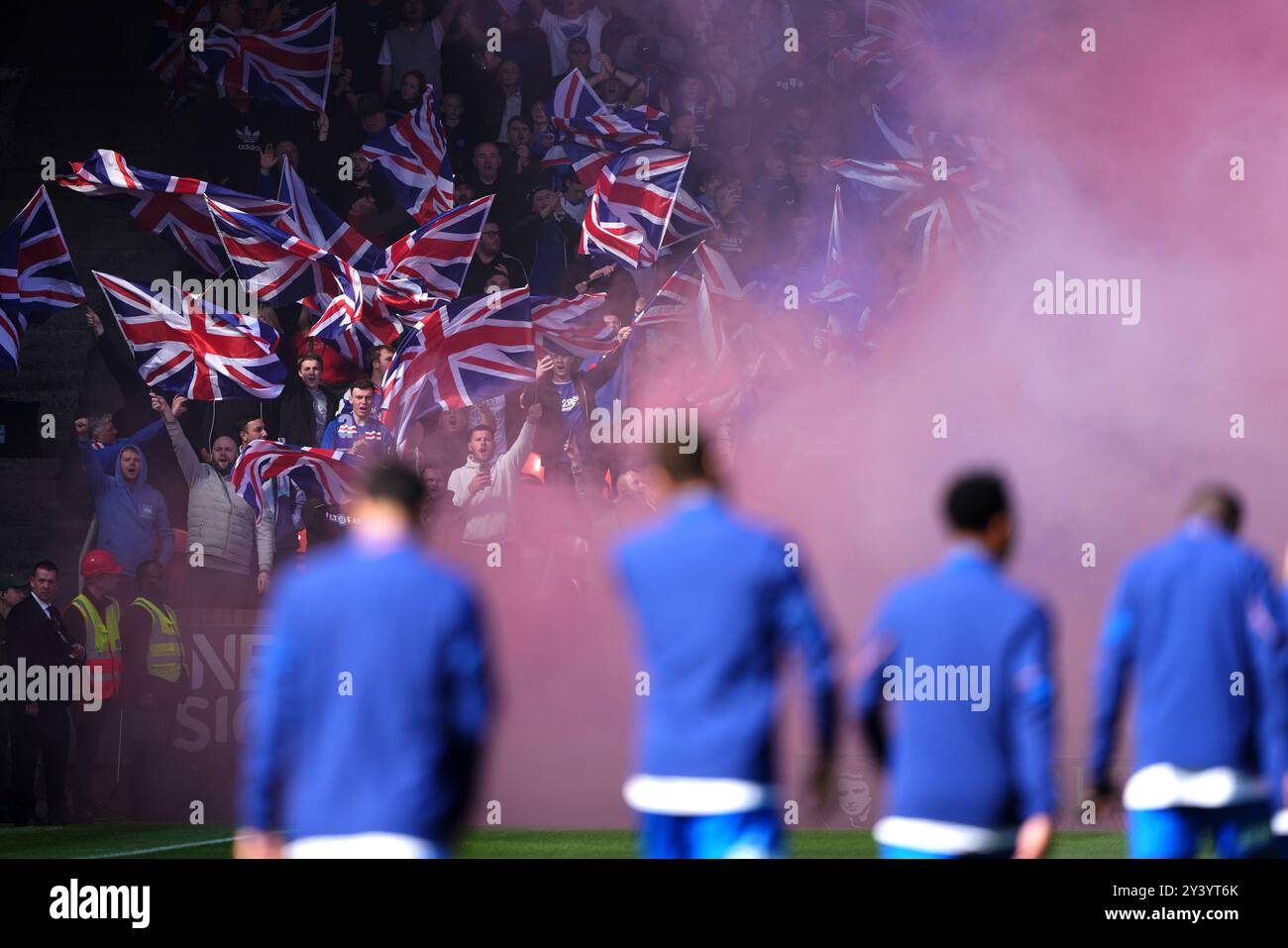 Rangers fans set off flares and wave flags of the United Kindom prior ...