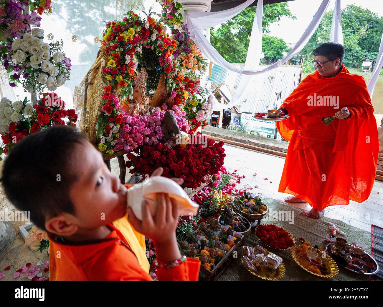 Hindu priests from Gurudeva Ashram are performing the ritual of ...