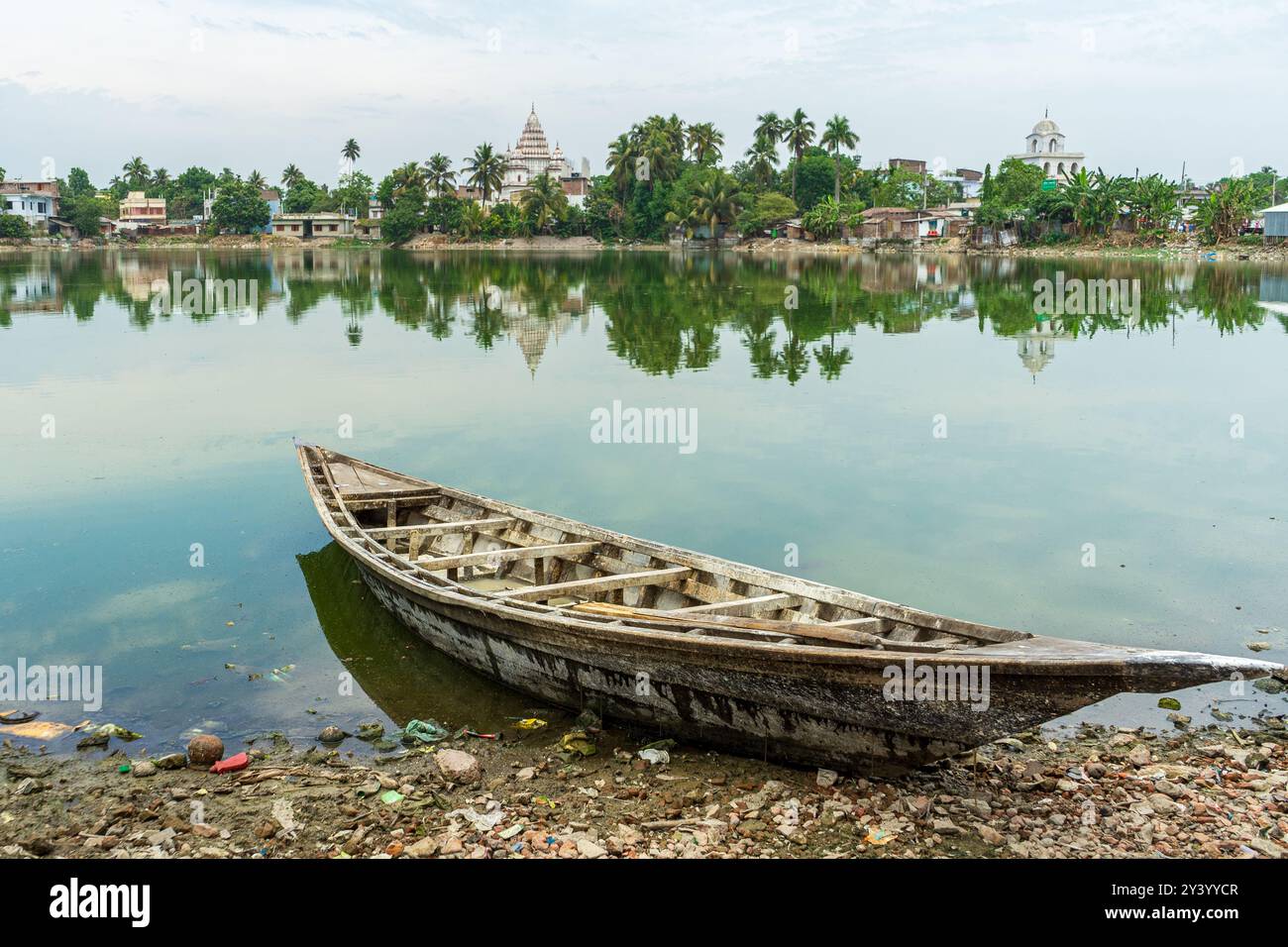 Traditional Bengali Wooden boat on pond bank Shiva Temple, at Puthia ...