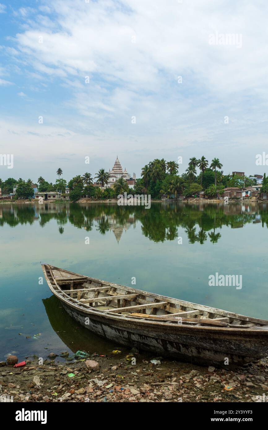 Traditional Bengali Wooden boat on pond bank Shiva Temple, at Puthia ...
