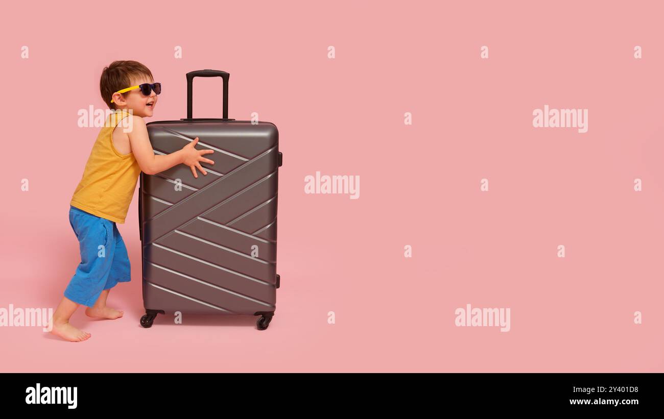 A child pulls a suitcase through the studio, imagining all the places ...