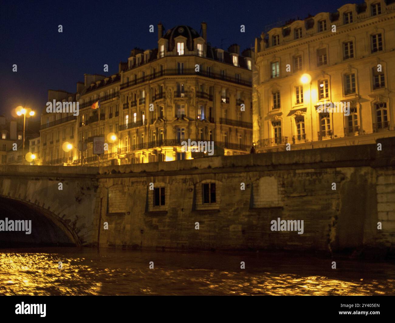 Night scene with illuminated historical buildings and bridge over the ...