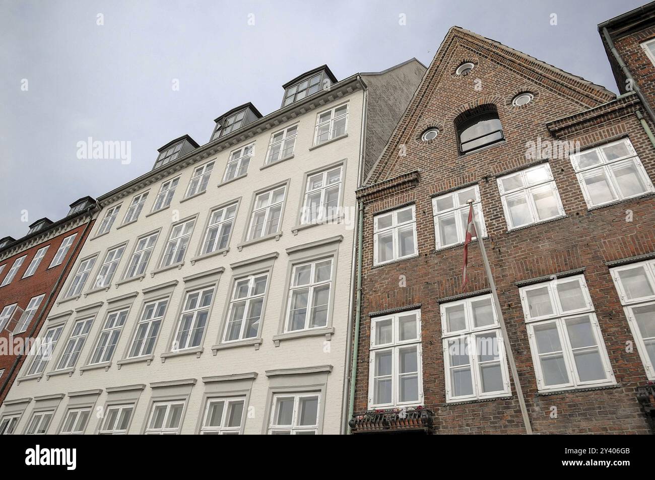 Row of historic buildings with different facades and many windows ...