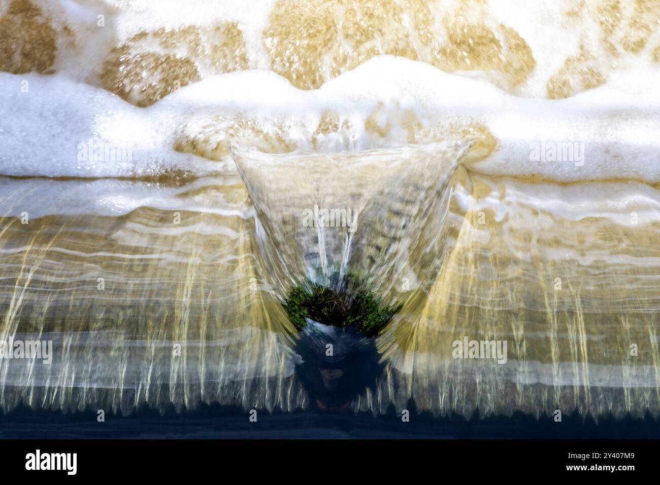 Top view of water flowing over an edge Stock Photo - Alamy