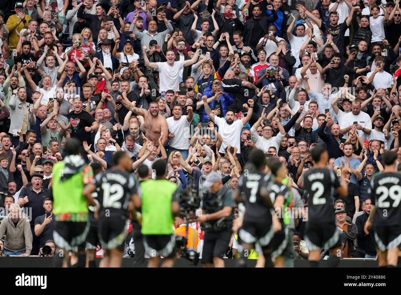 Arsenal players celebrate in front of their fans after the English ...