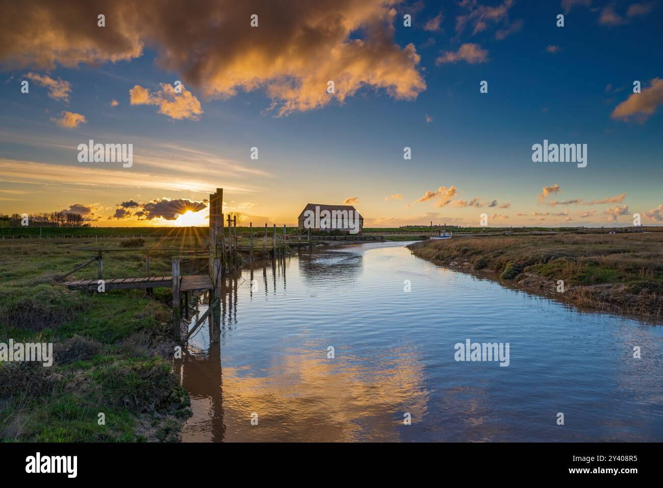 The old Coal Barn and Quay at Thornham Old Harbour, during sunset ...