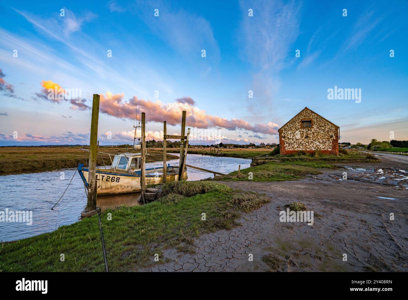 The old Coal Barn and Quay at Thornham Old Harbour, during sunset ...