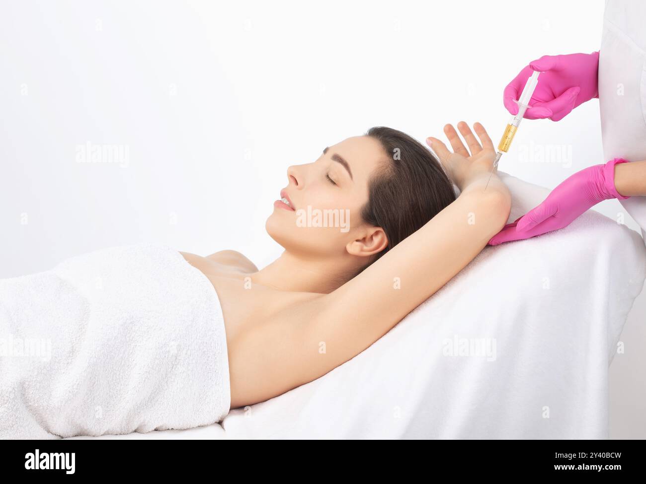 Doctor doing stem cell therapy on a patient's elbow after the injury. Treating knee pain with ...