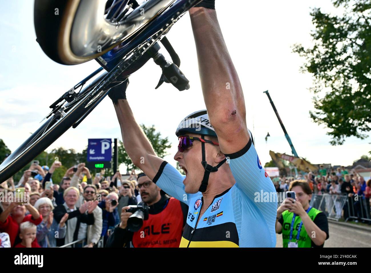 Winner European champion Belgian Tim Merlier celebrates with his bike ...
