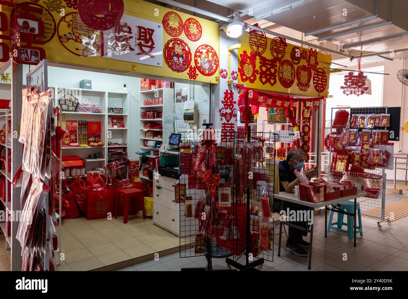 A small Chinese hawker stall in the Chinatown Complex filled with ...