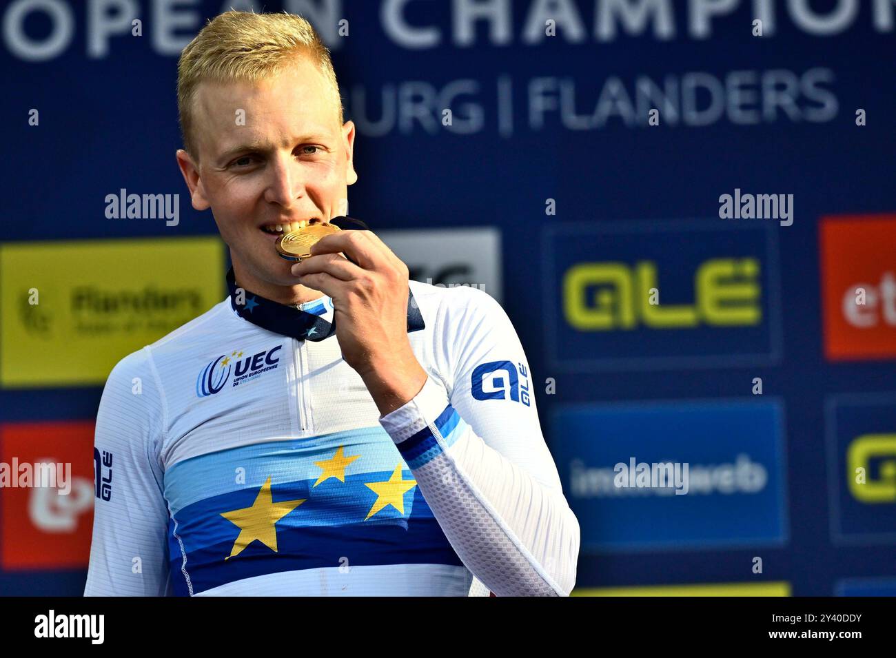 Winner European champion Belgian Tim Merlier celebrates on the podium ...
