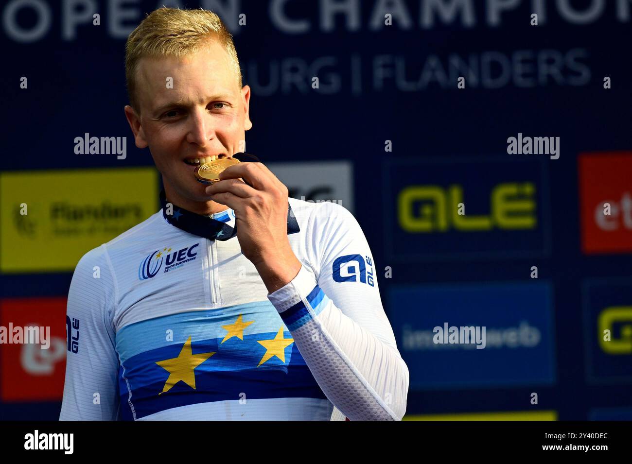 Winner European champion Belgian Tim Merlier celebrates on the podium ...