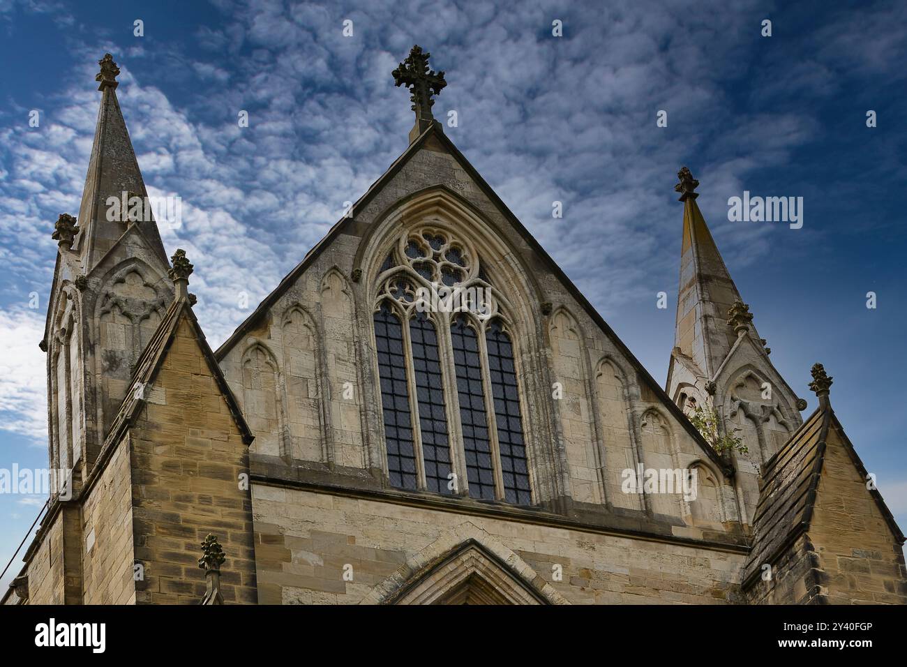 A close-up view of a historic church building featuring pointed spires ...