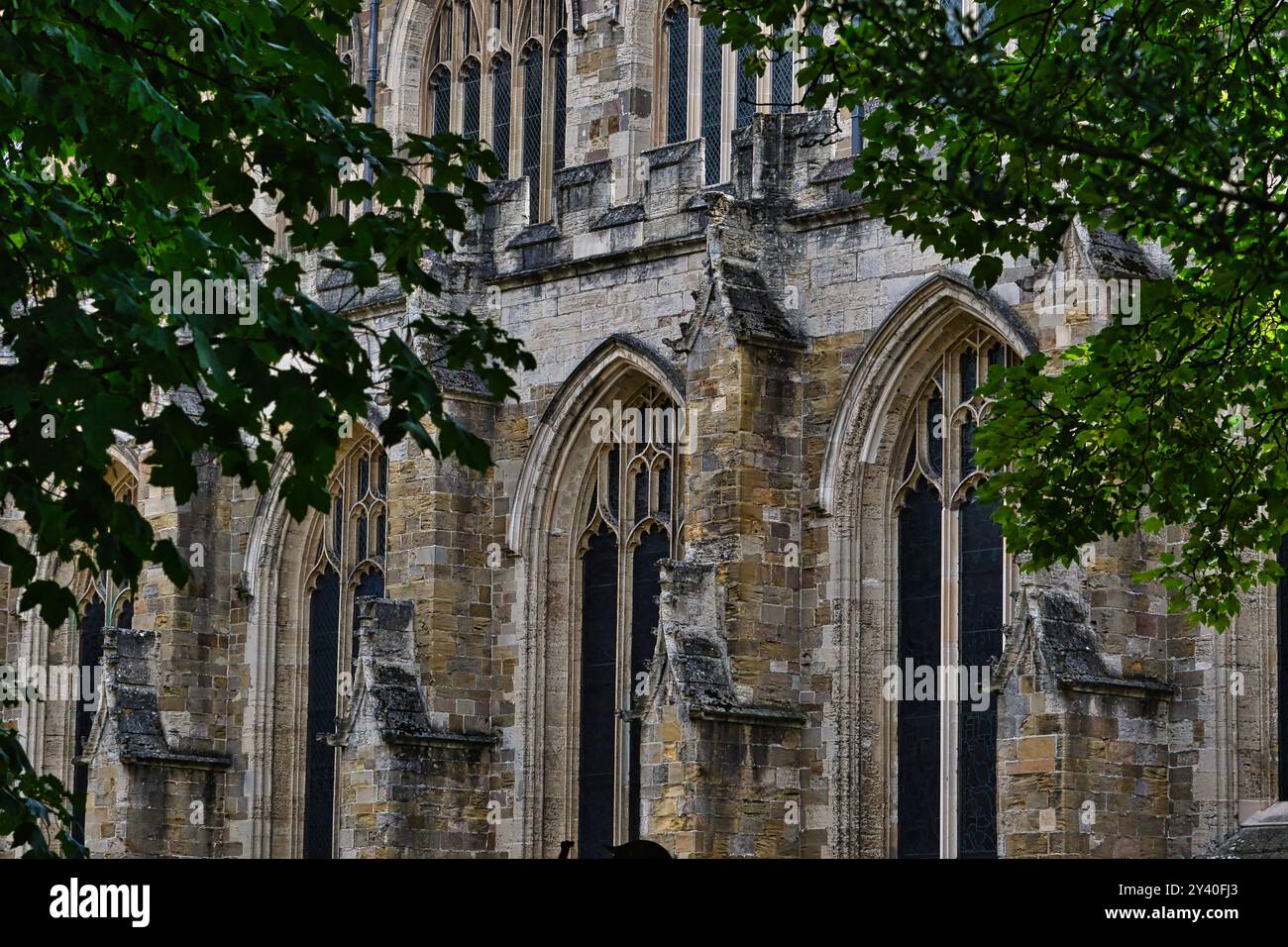 A close-up view of a historic stone church facade, featuring intricate ...