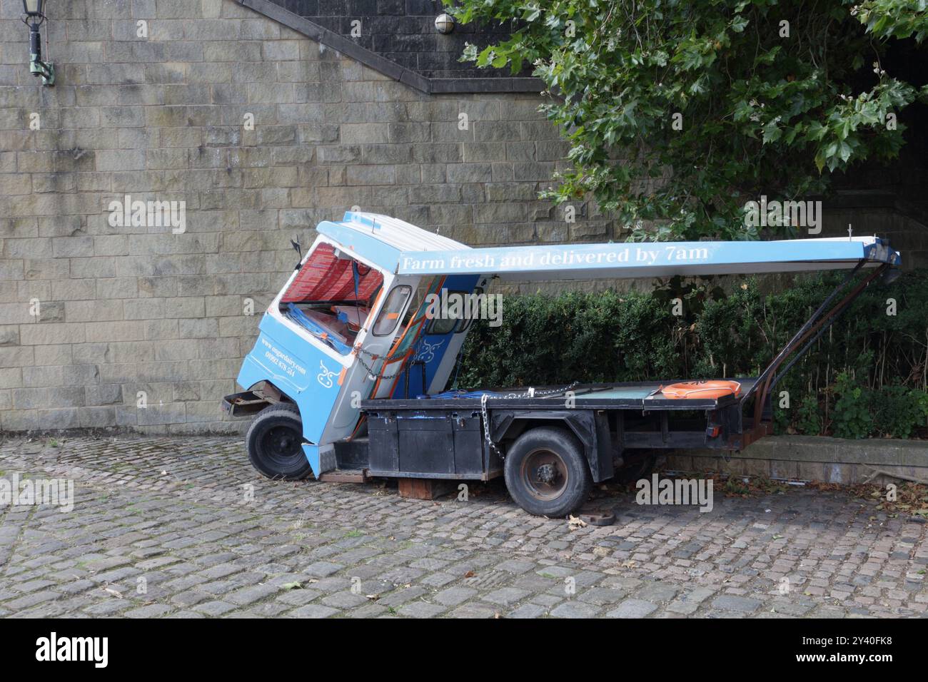 A badly damaged milk float electric vehicle, at Victoria Quays ...