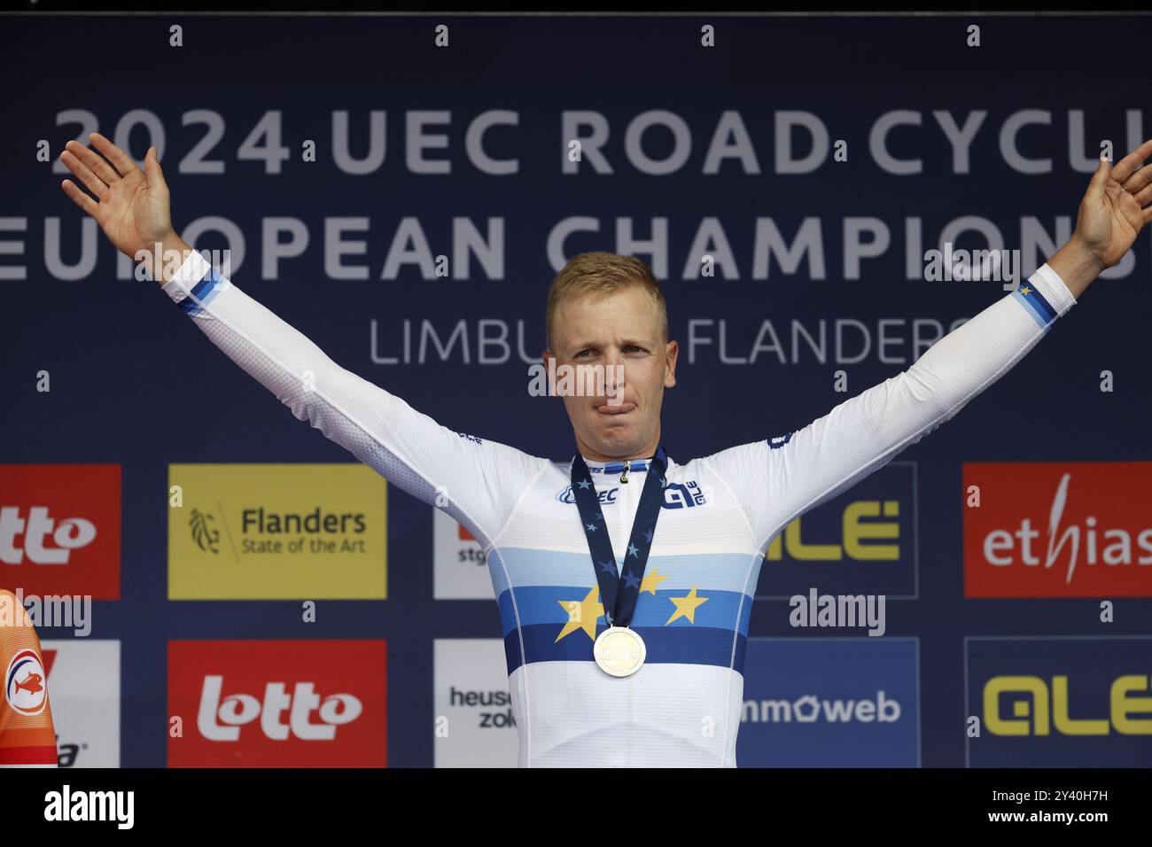 Belgium's Tim Merlier celebrates on the podium after winning the men's ...
