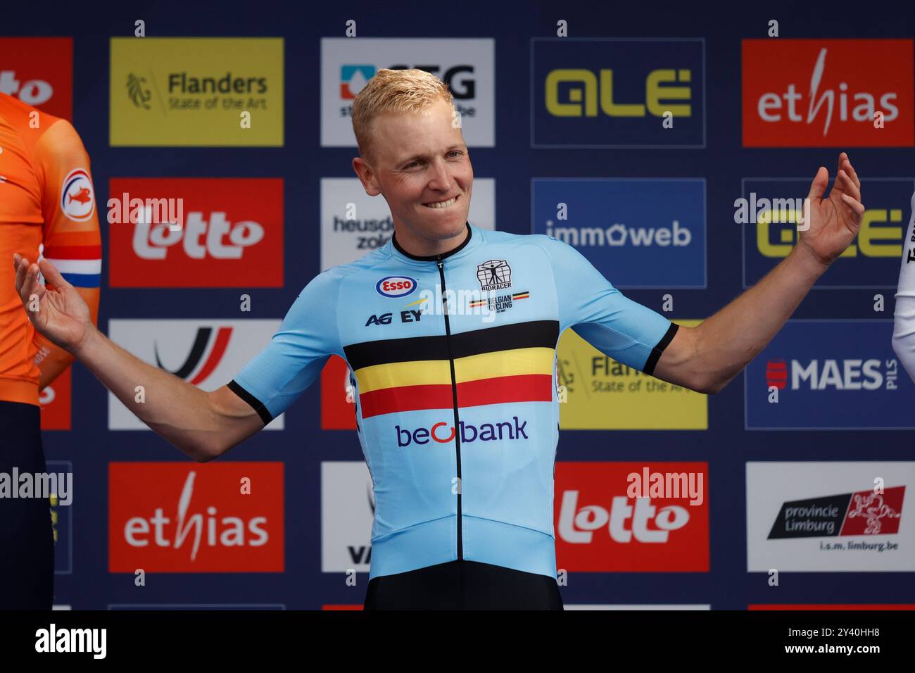 Belgium's Tim Merlier celebrates on the podium after winning the men's ...