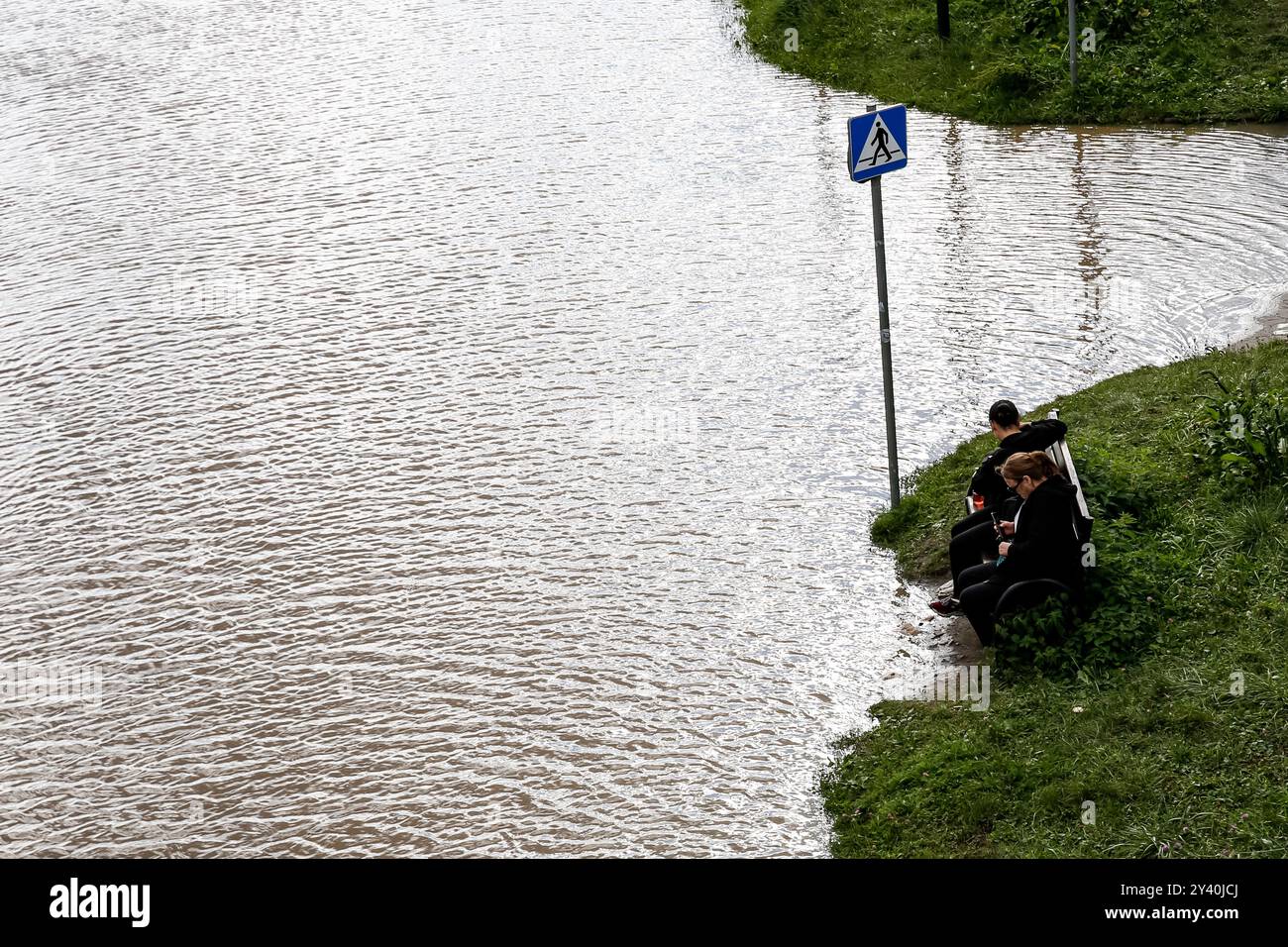 Krakow, Poland. 15th Sep, 2024. People are seen looking at flooded ...