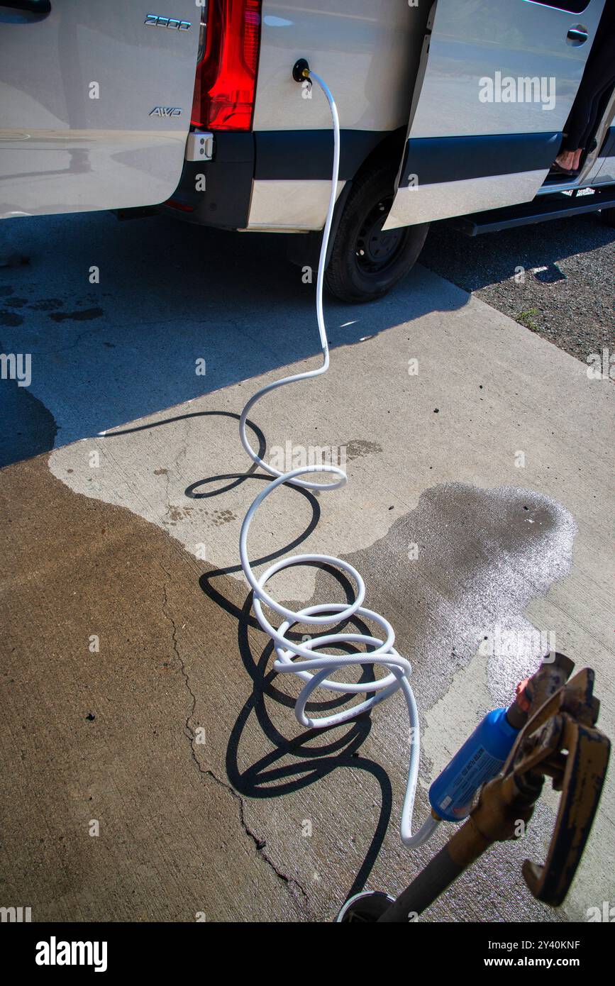 Using a clean chemical free hose to fill a water tank on a Mercedes ...