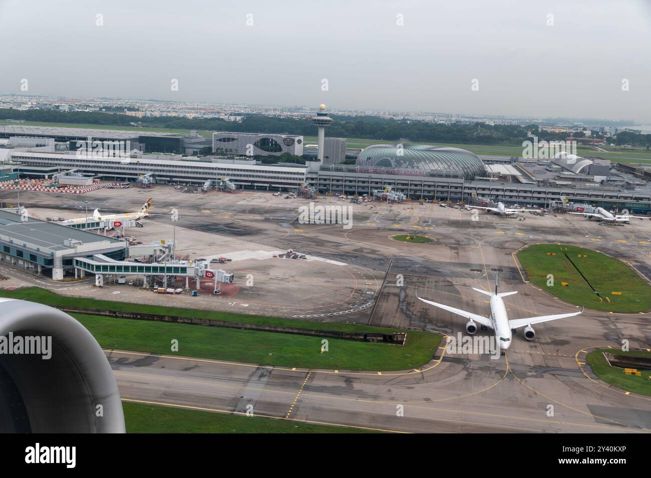 A passenger’s window view of Changi Airport after take-off in Singapore ...