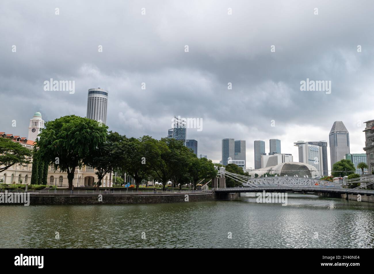 Skyline of Singapore and the Singapore River. On the left bank is the ...
