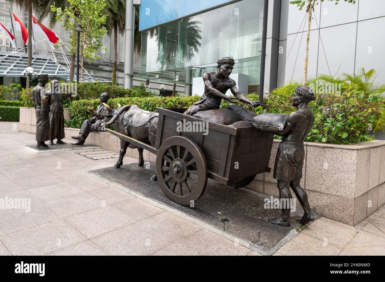 At the 32-storey Maybank Tower are some statues called ‘River Merchants ...