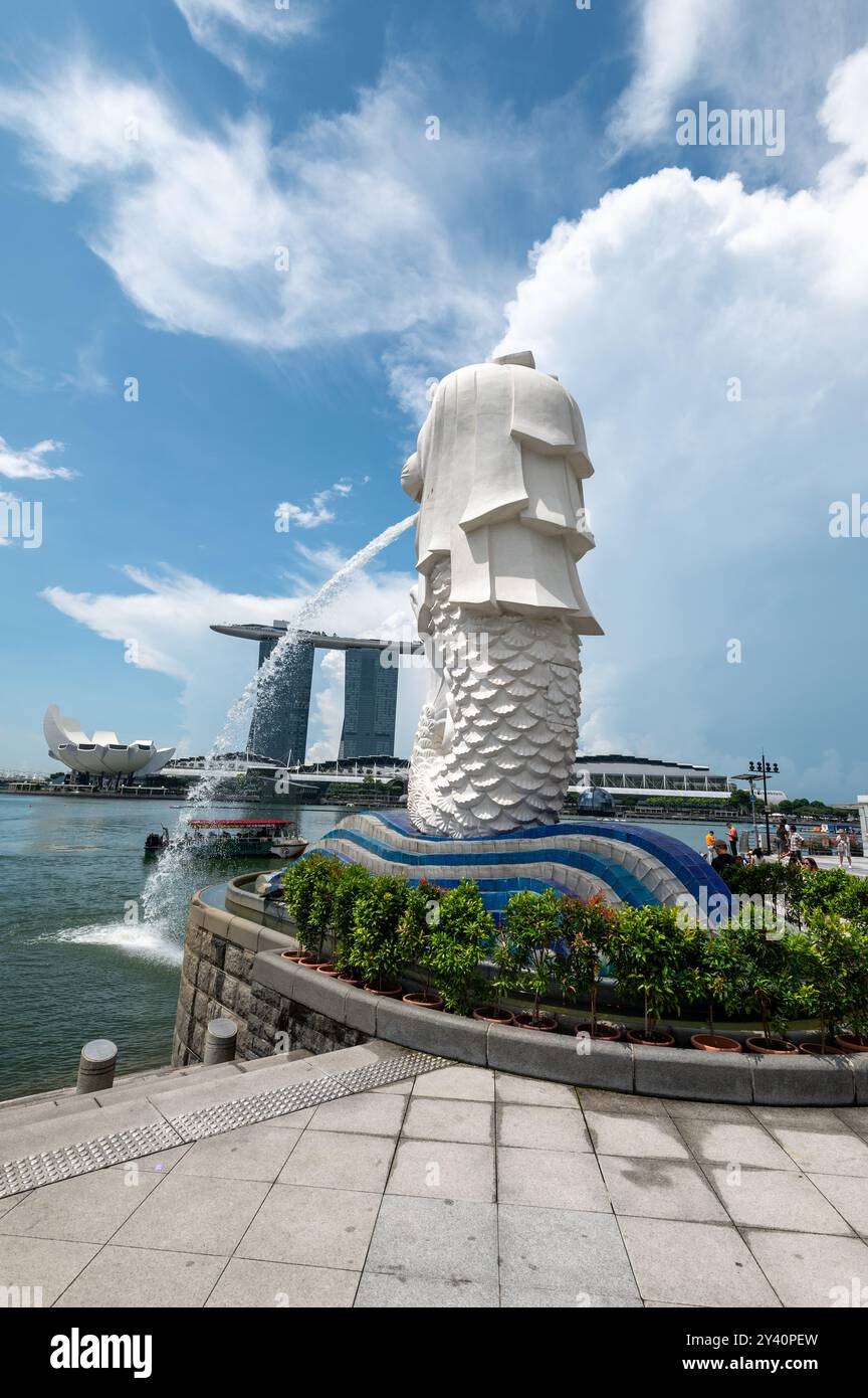 In the background is the Marina Bay Sands Hotel across Marina Bay in ...