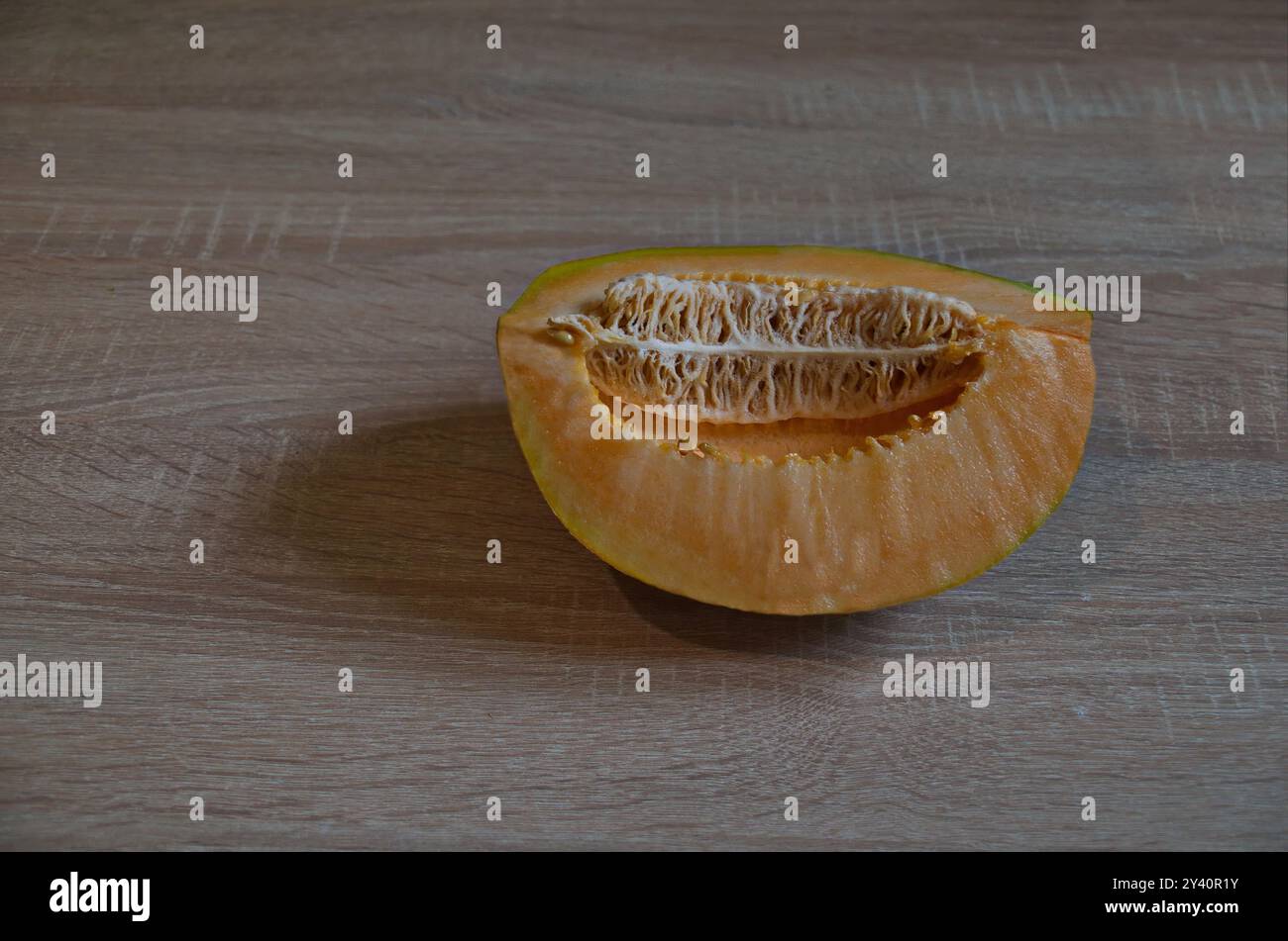 A close up photo of a section of a fresh ripe melon with details of its ...