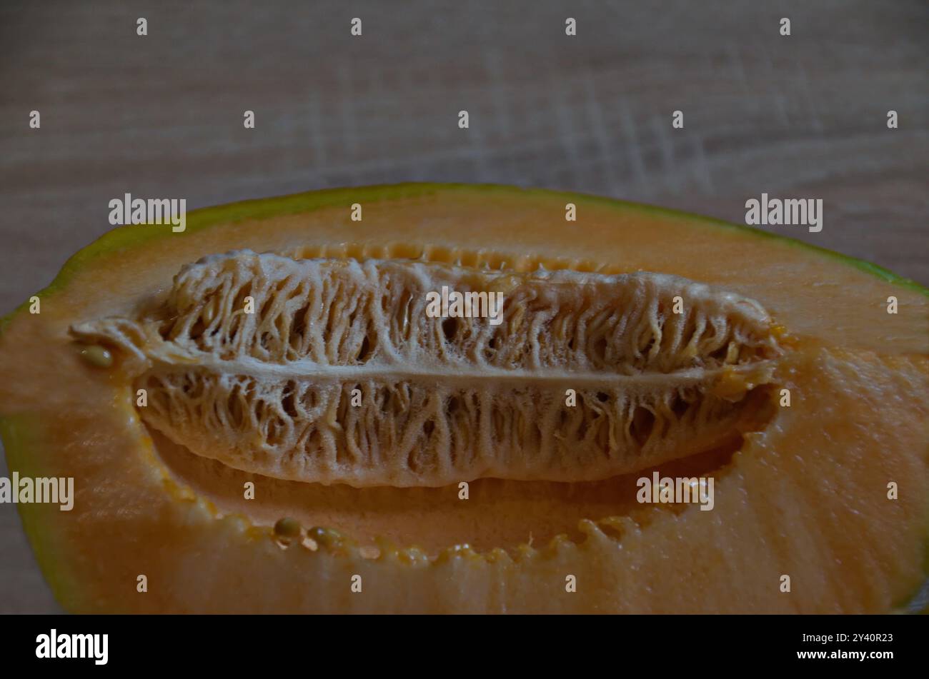 A close up photo of a section of a fresh ripe melon with details of its ...
