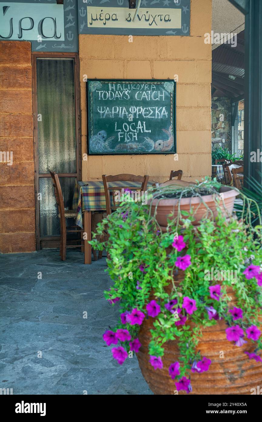 Greek taverna in village of Stoupa, Peloponnese, Greece Stock Photo - Alamy