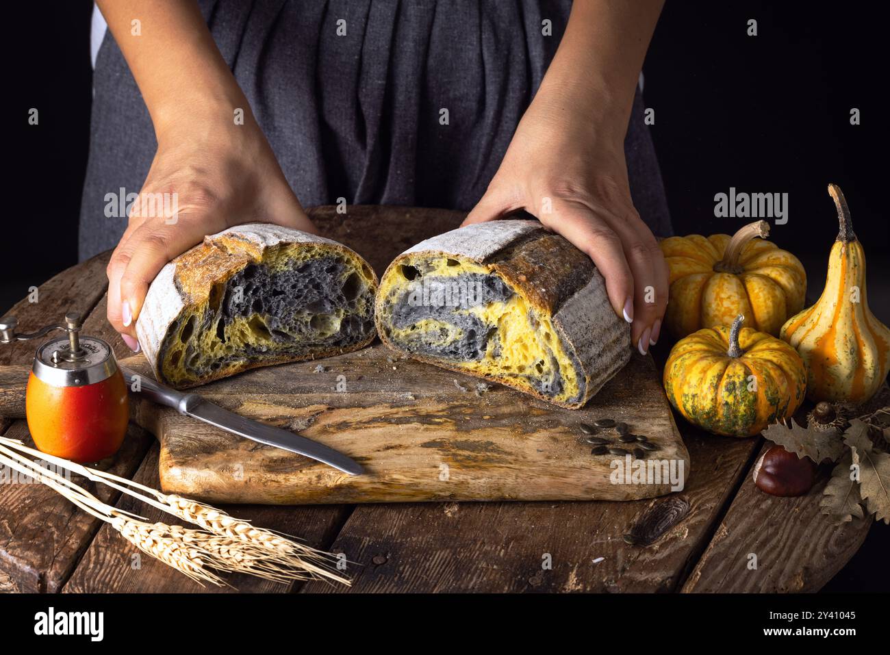 Homemade crusty sourdough bread oven baked and woman baker with autumn ...