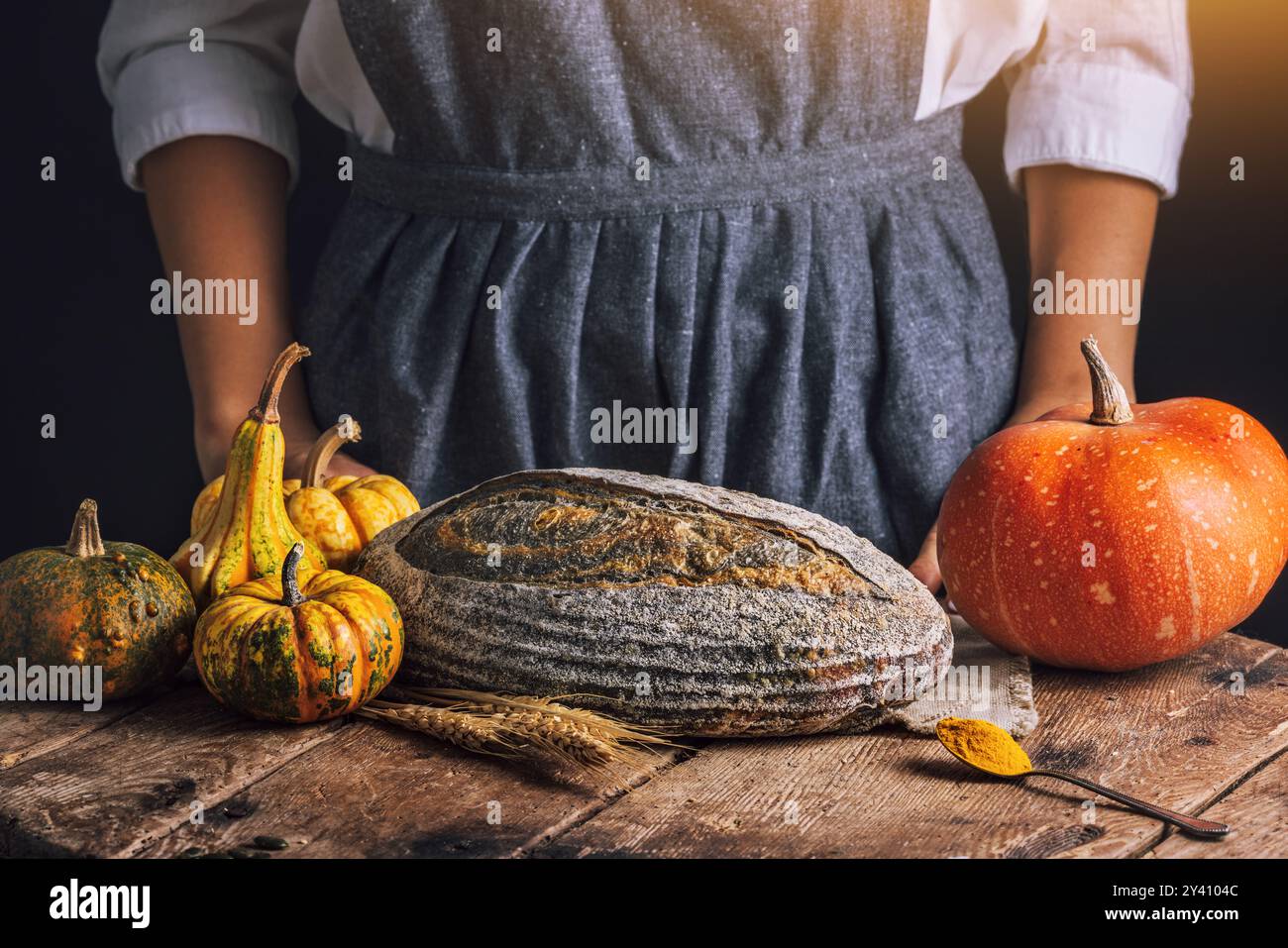Homemade crusty sourdough bread oven baked and woman baker with autumn ...