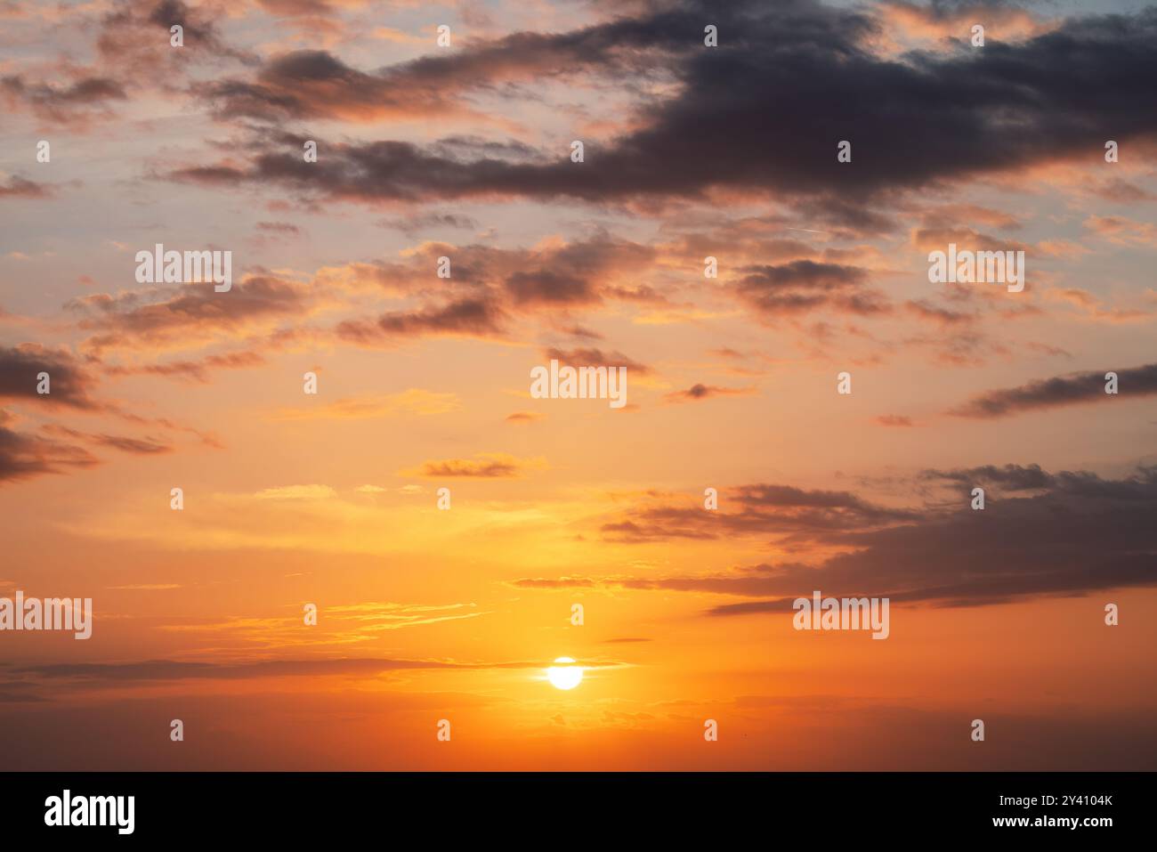 Sunset dramatic sky clouds and sun dawn Stock Photo - Alamy