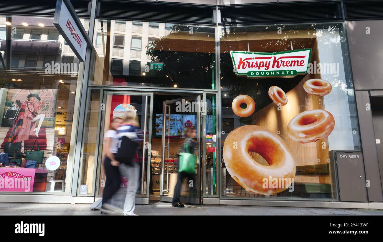 A krispy Kreme signage outside a stor in Cheapside, London Stock Photo ...