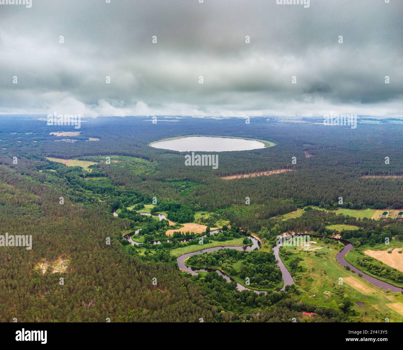 Aerial view of the lake and river in the forest. River Merkys and lake ...