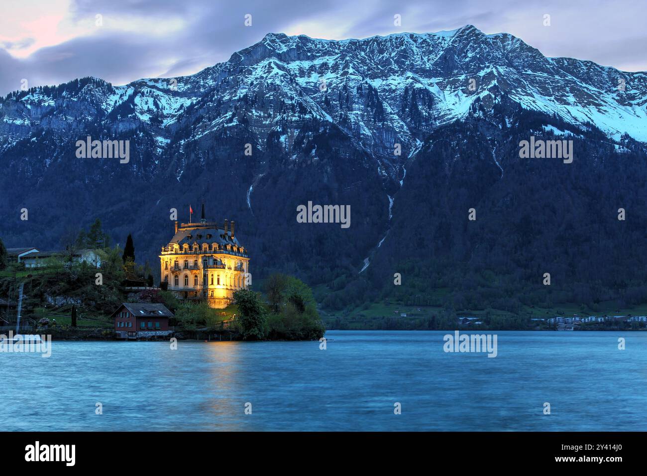 Spring evening in Iseltwald, with the imposing Castle Seeburg with ...