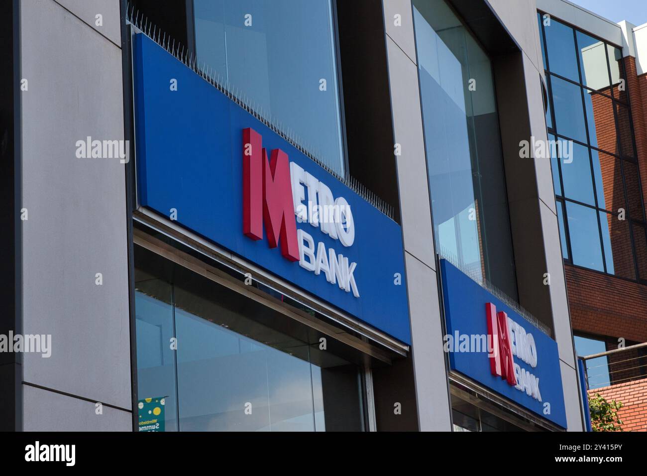 Exterior view of a Metro Bank branch, featuring a prominent blue sign ...