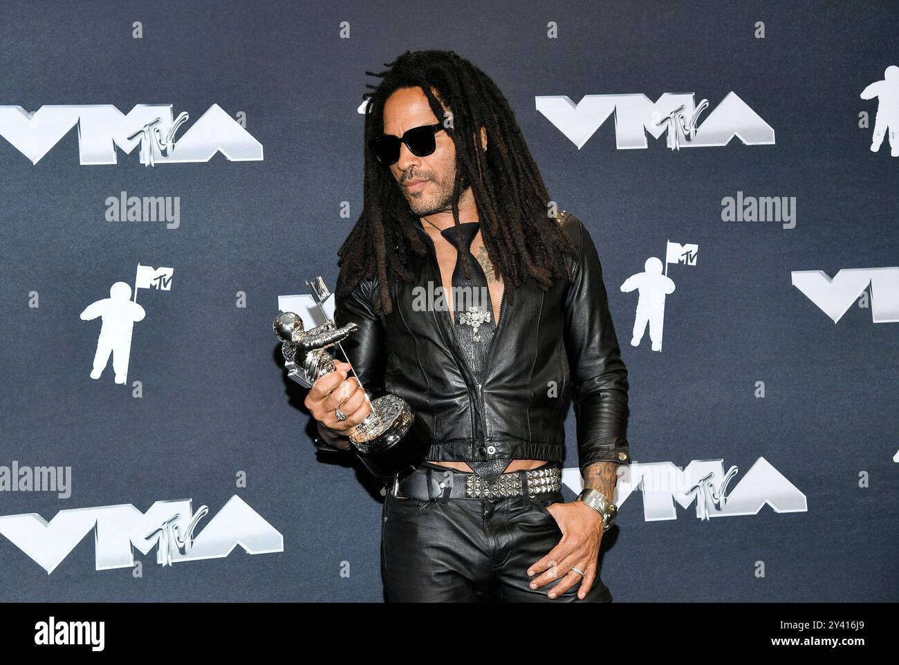 Lenny Kravitz poses in the press room during the MTV Video Music Awards ...