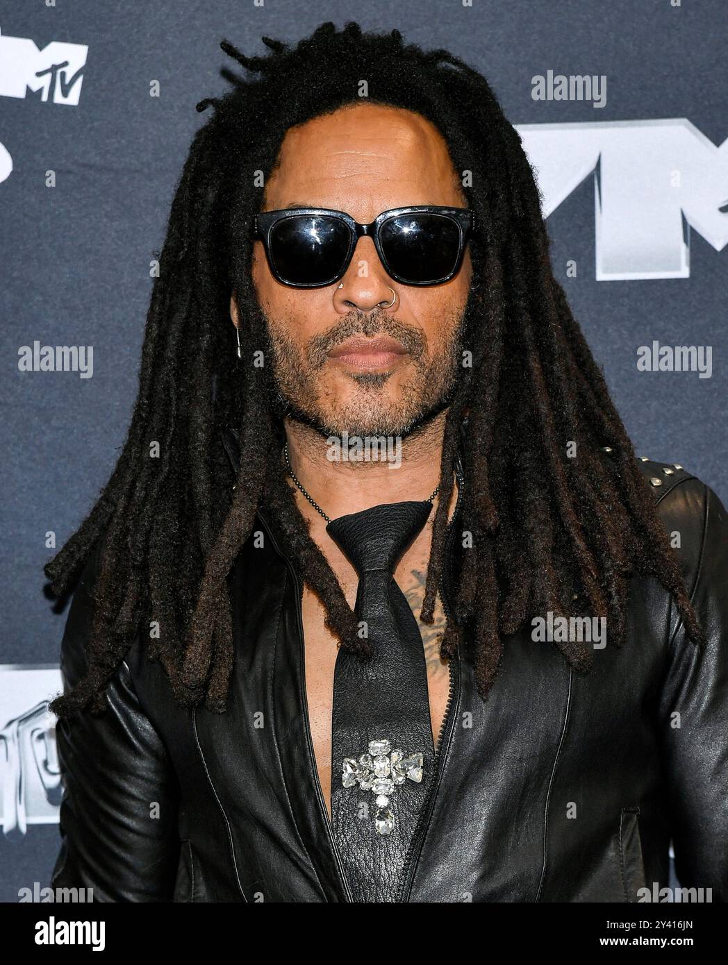 Lenny Kravitz poses in the press room during the MTV Video Music Awards ...