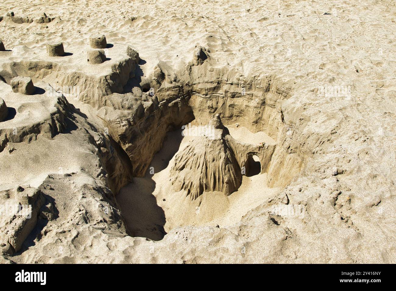 Aerial view of a sand sculpture resembling a castle with towers and a ...