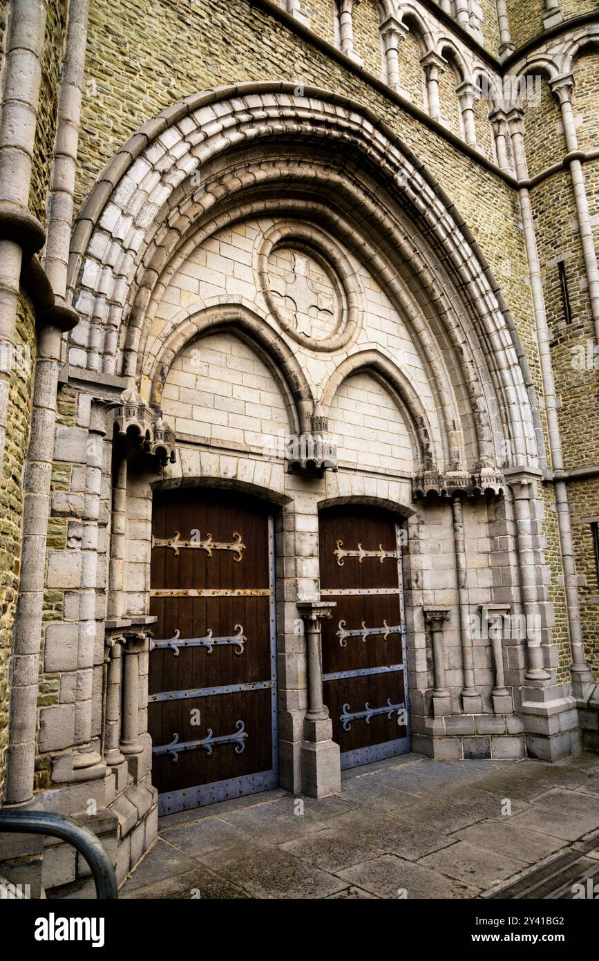 Archivolt entrance to Our Lady Church in Bruges, Belgium Stock Photo ...