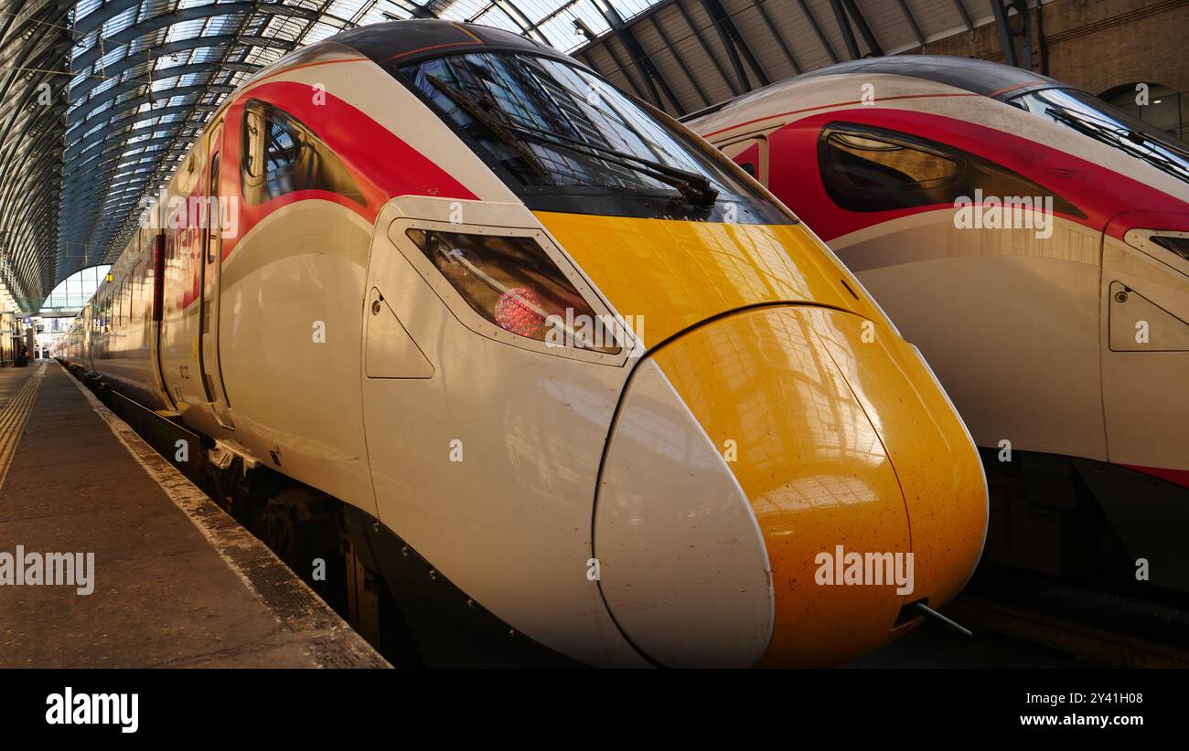 The LNER railway ticket against a background of Azuma trains at King's Cross station Stock Photo ...