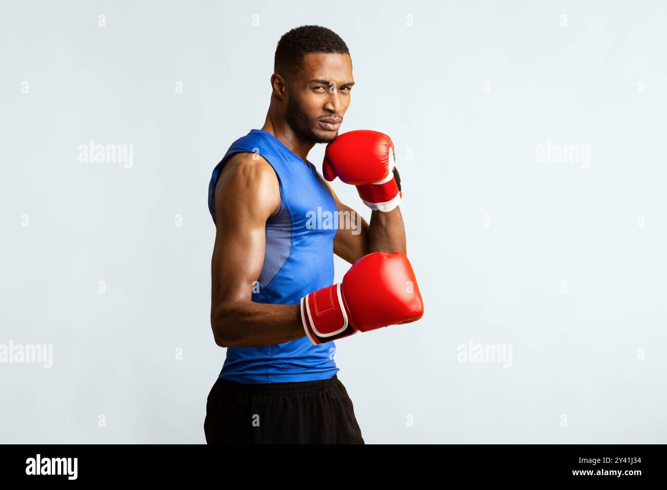 Confident afro fighter demonstrating classical boxing stance Stock ...