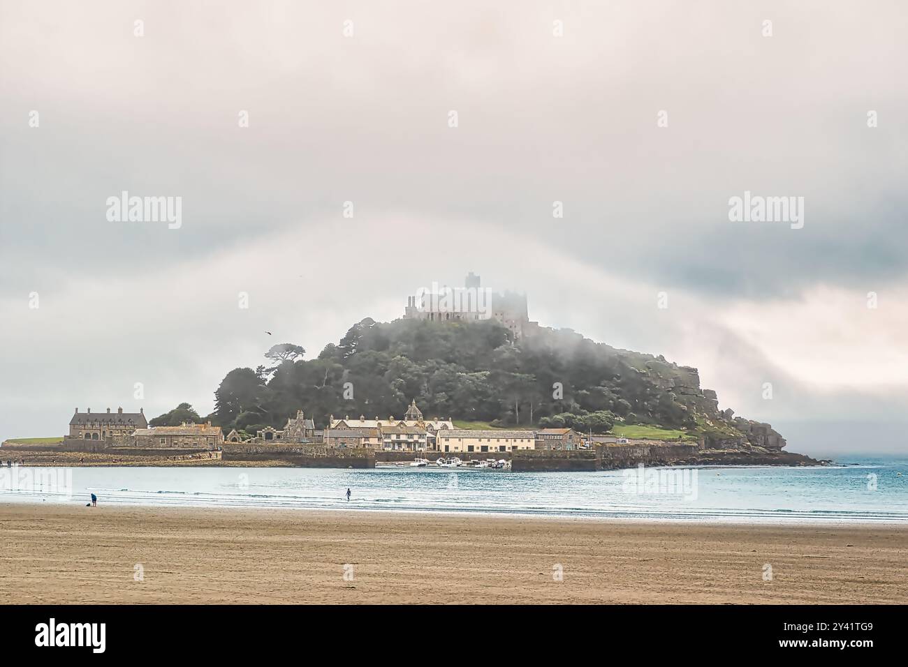 A misty view of St. Michael's Mount, an island with a historic castle ...