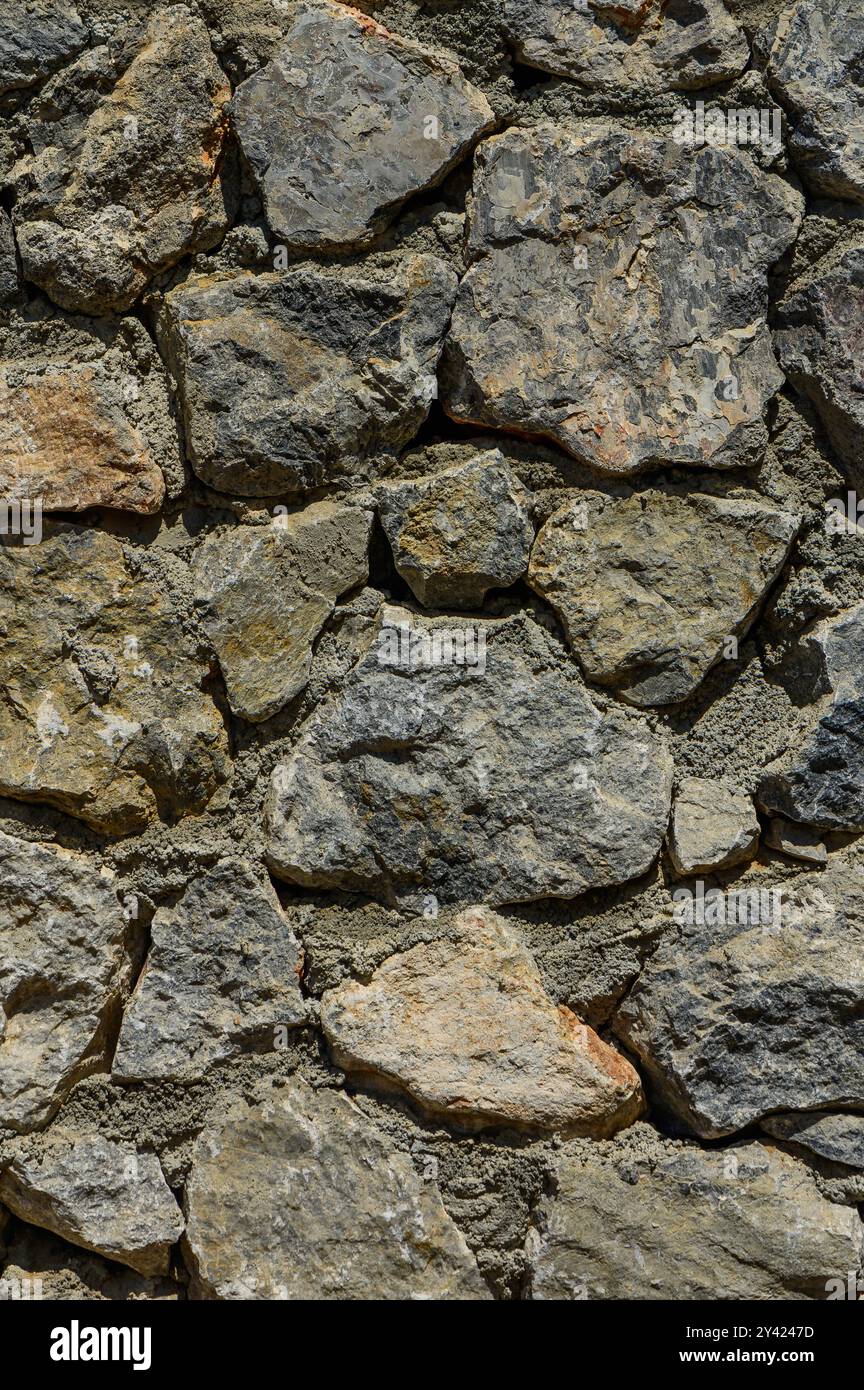 Stone wall texture background - grey stone siding with different sized ...